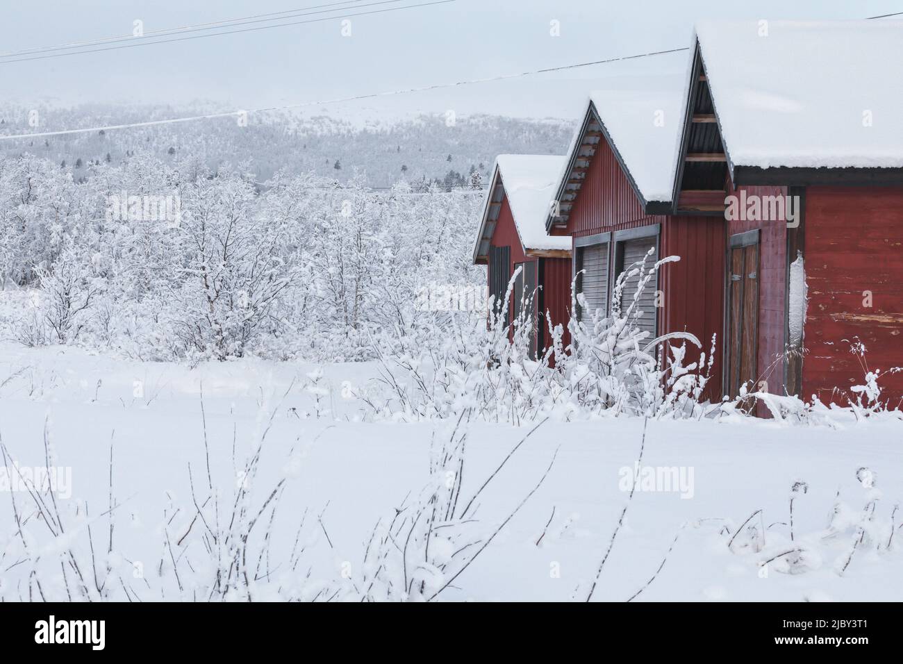 Barns covered in snow. Winter scene in Swedish Lapland Stock Photo - Alamy
