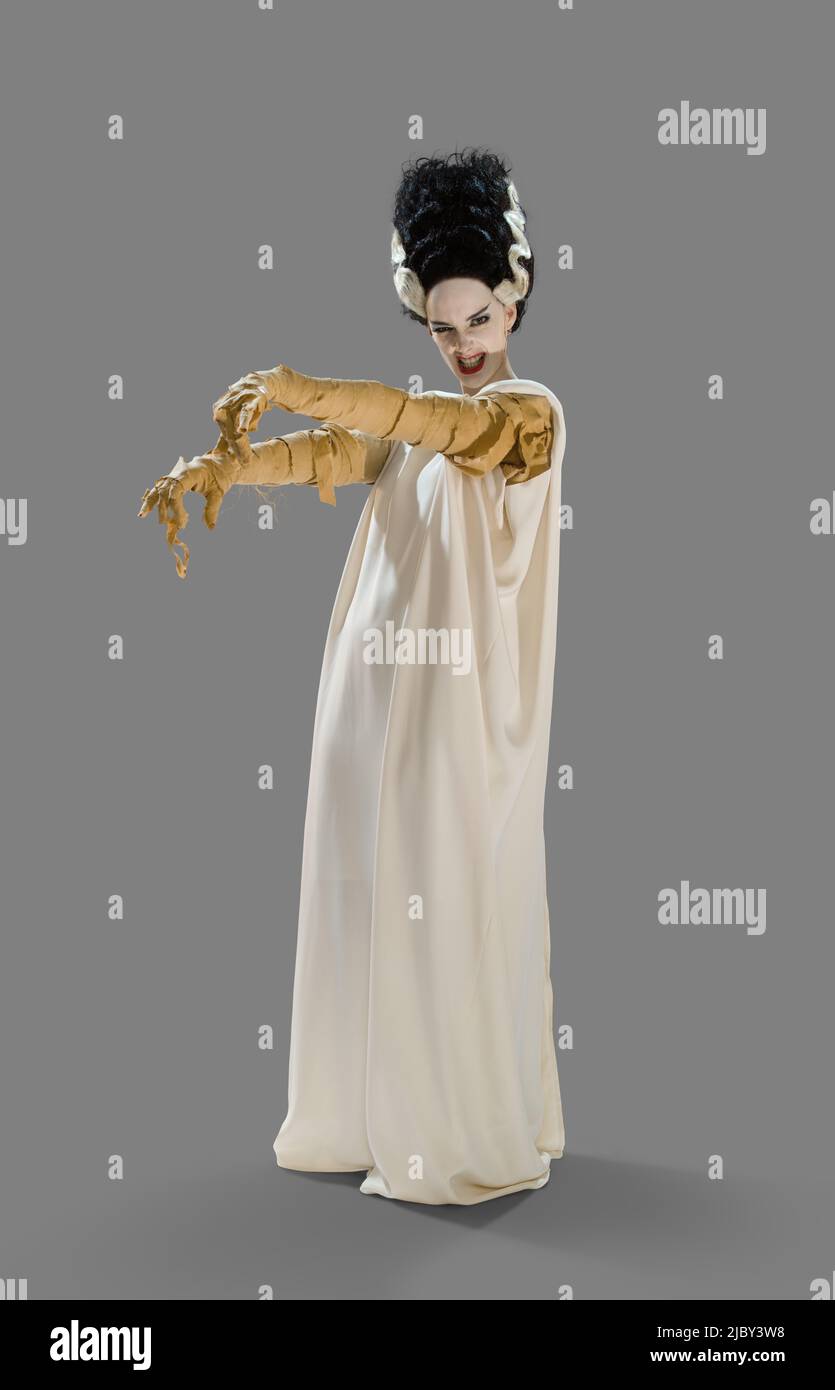 Full length portrait of a woman dressed up as the Bride Of Frankenstein ...