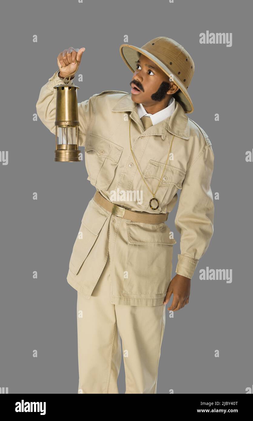 Portrait of a boy dressed up as archaeologist mummy hunter with a fake ...