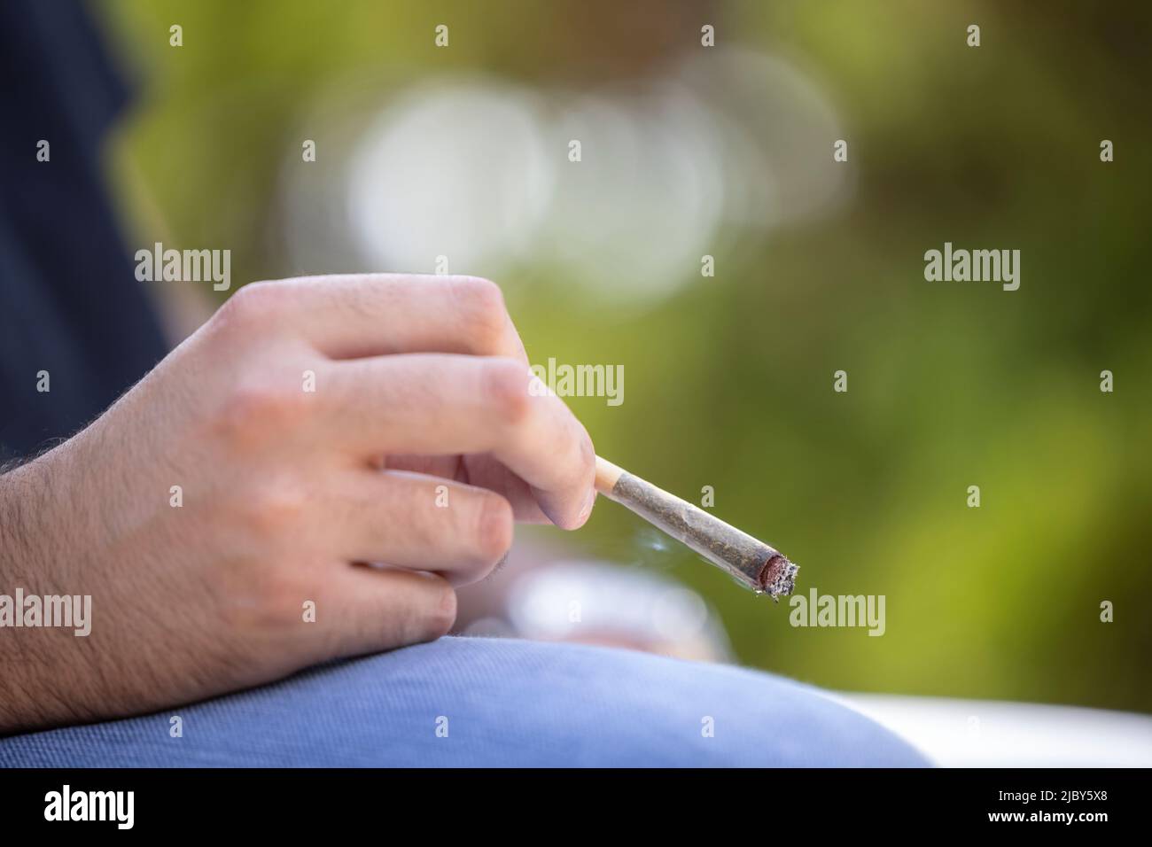 Cannabis joint holding hi-res stock photography and images - Alamy