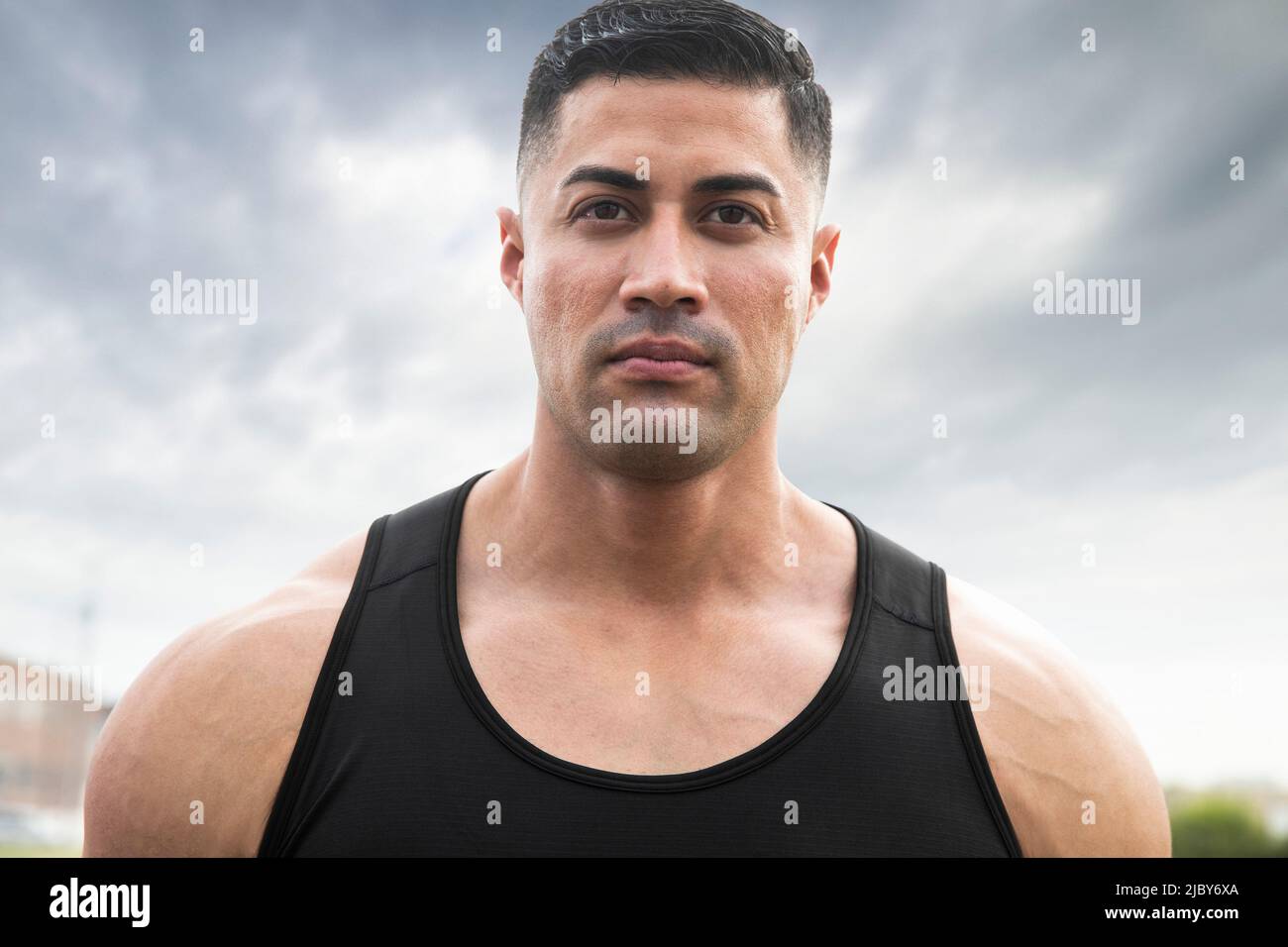 Man wearing tank top hi-res stock photography and images - Alamy