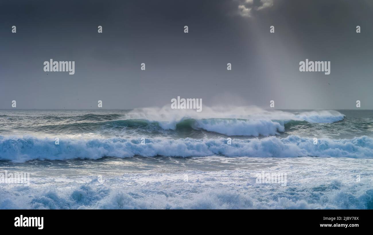 Wave curling over and breaking during cyclone Ola with stormy sky Stock ...