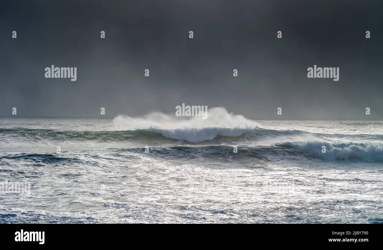 Wave curling over and breaking during cyclone Ola with stormy sky Stock ...