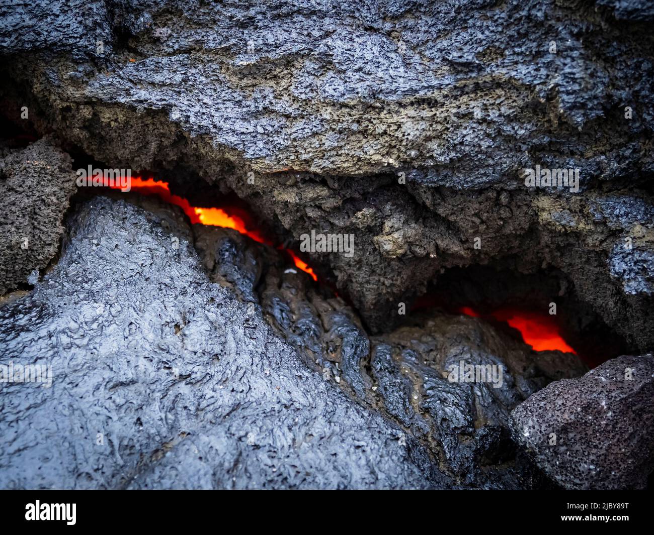 Hot magma visible underneath cooled lava crust, Fagradalsfjall volcano ...