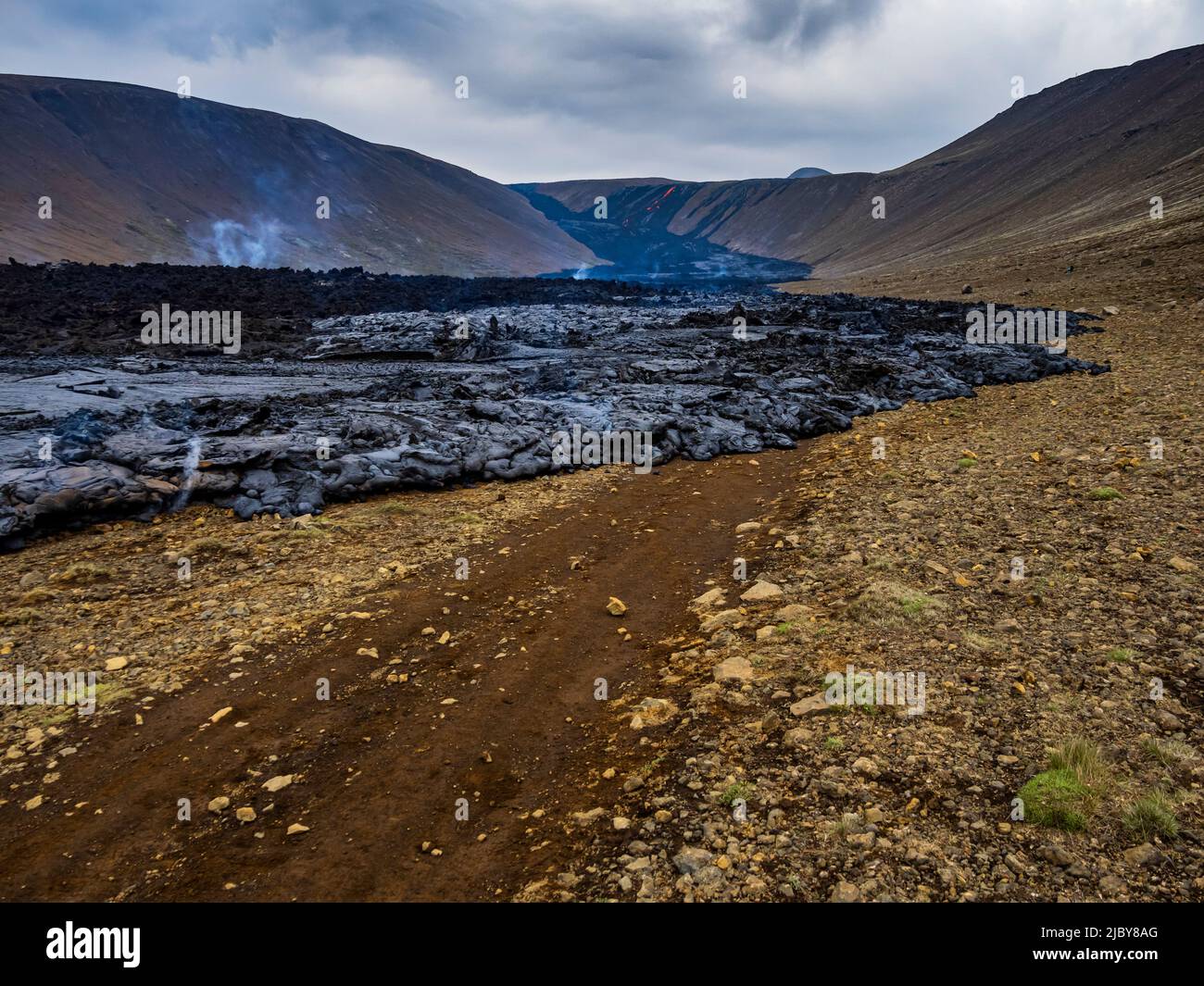 Road being covered by fresh lava from Fagradalsfjall Volcano, Iceland ...