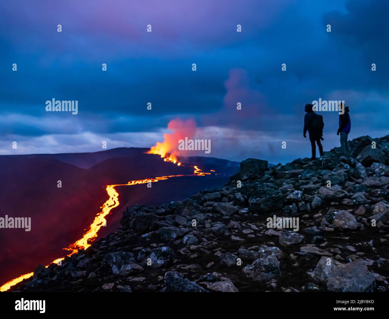 Hikers view glowing river of magma and lava cascades, Fagradalsfjall ...