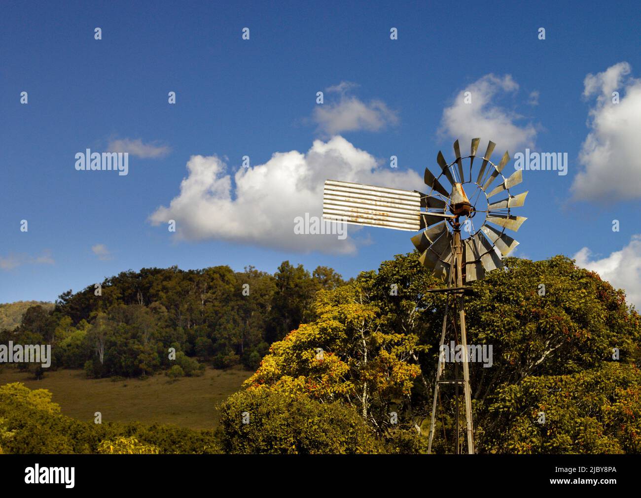 Wind driven water pump on Australian farmland Stock Photo - Alamy