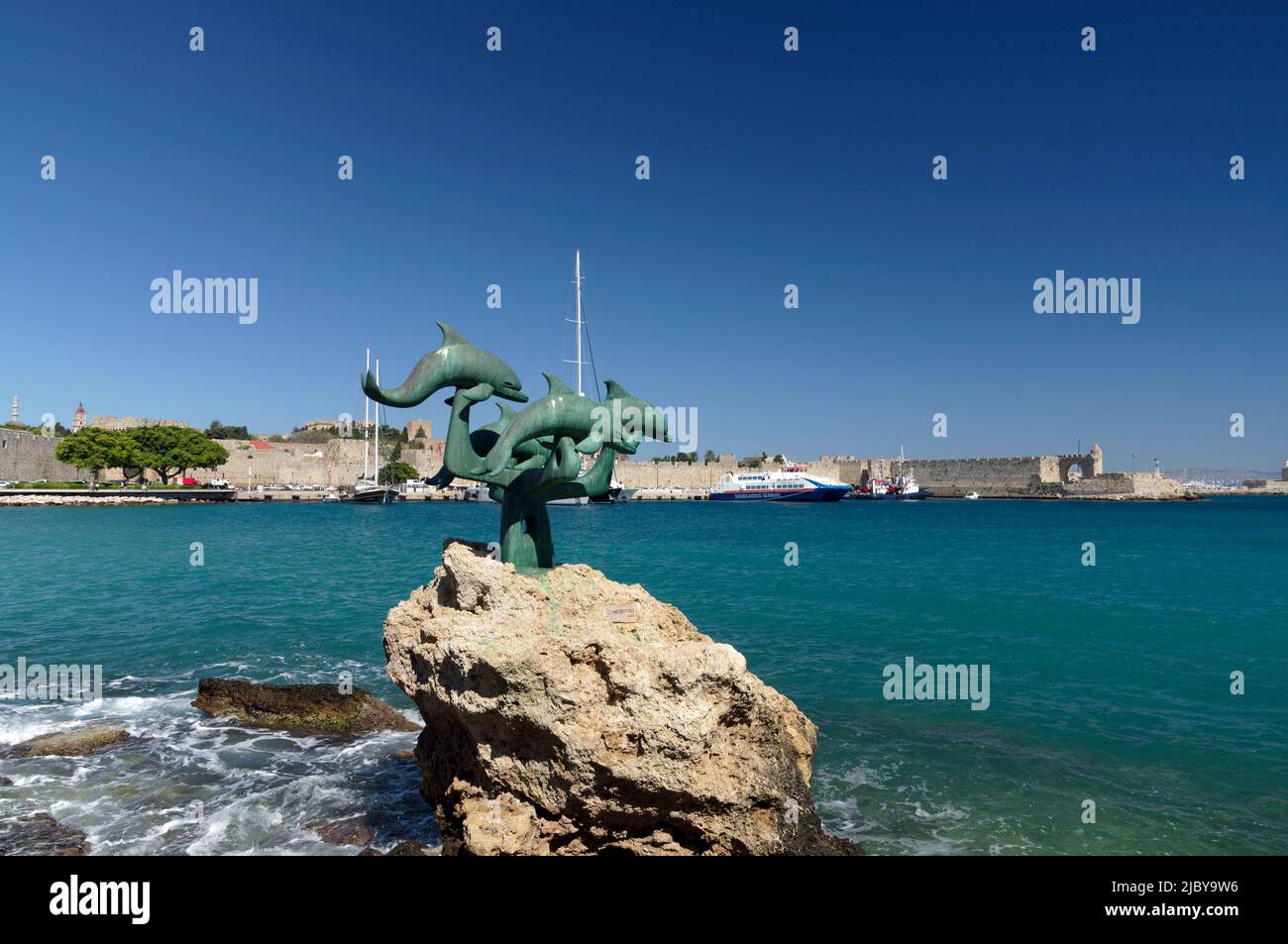 Bronze dolphin statue near Kolona harbour, Rhodes Town, Rhodes Island ...