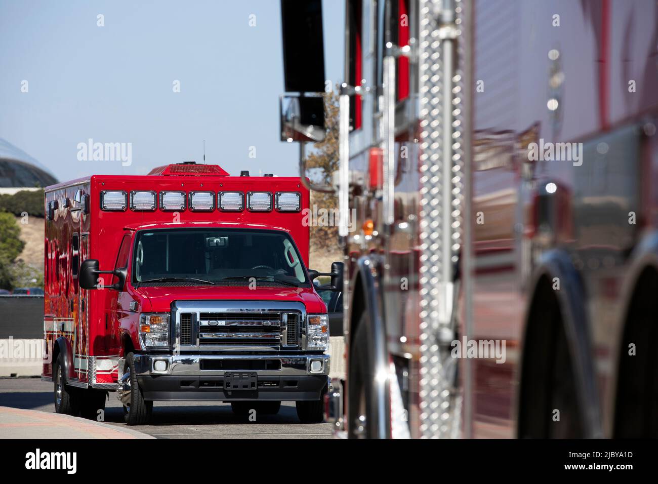 An ambulance and fire truck respond to the scene of an emergency Stock ...