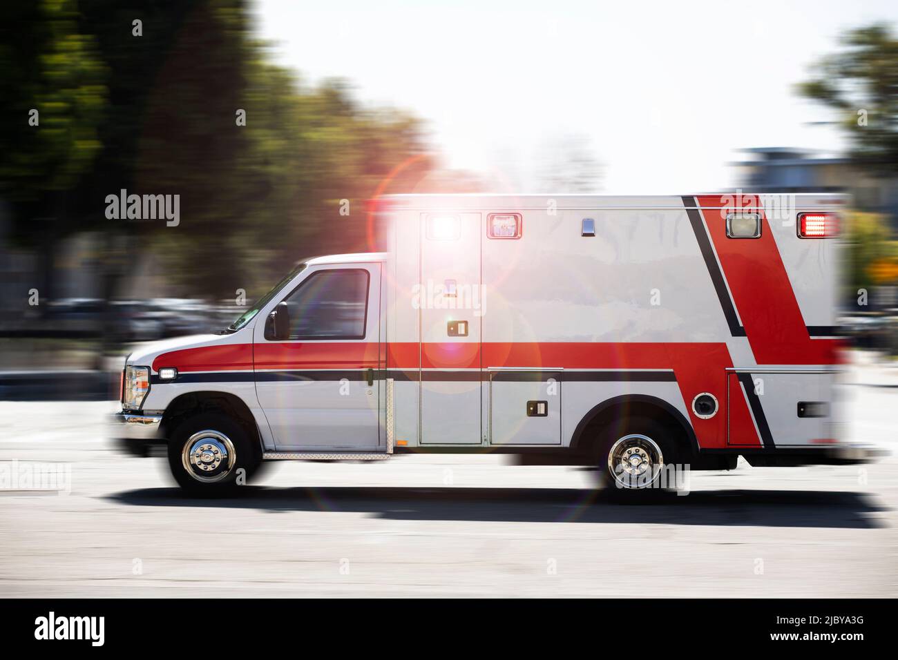 Blurred motion action view of an ambulance responding to the scene of ...