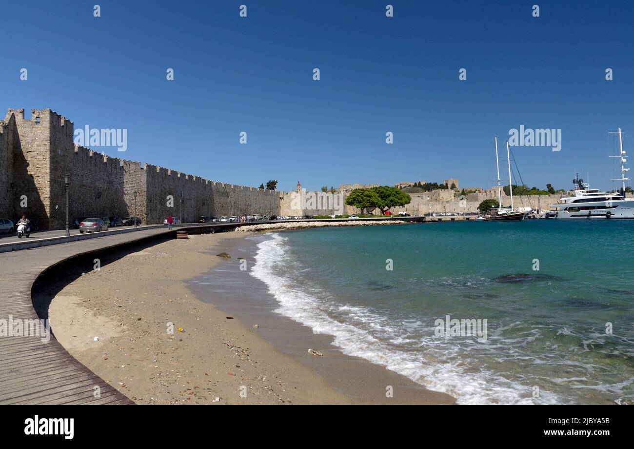Rhodes Town beach with Old Town castle walls, Rhodes Island, Greece ...