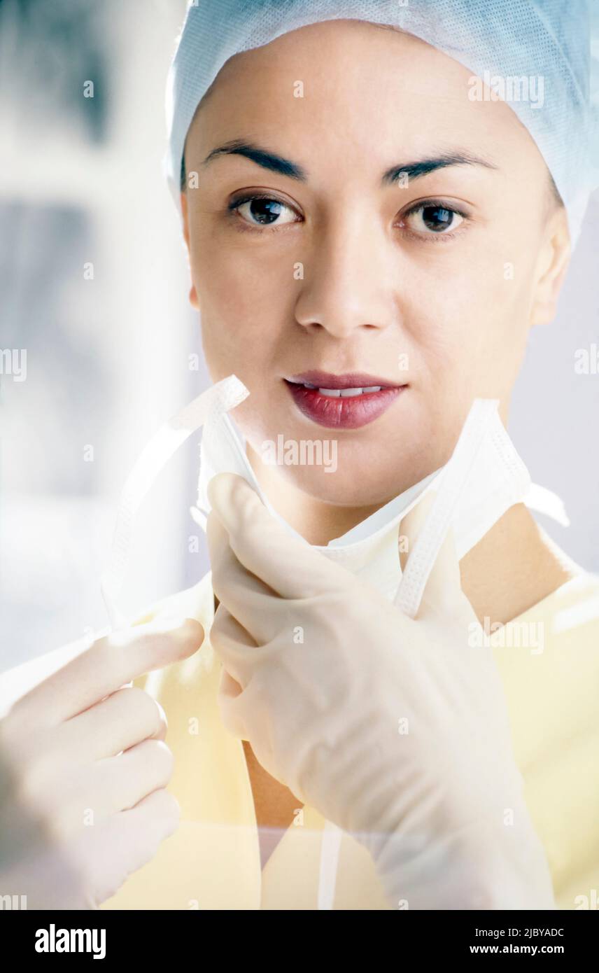 Theatre nurse dressing for surgery Stock Photo - Alamy