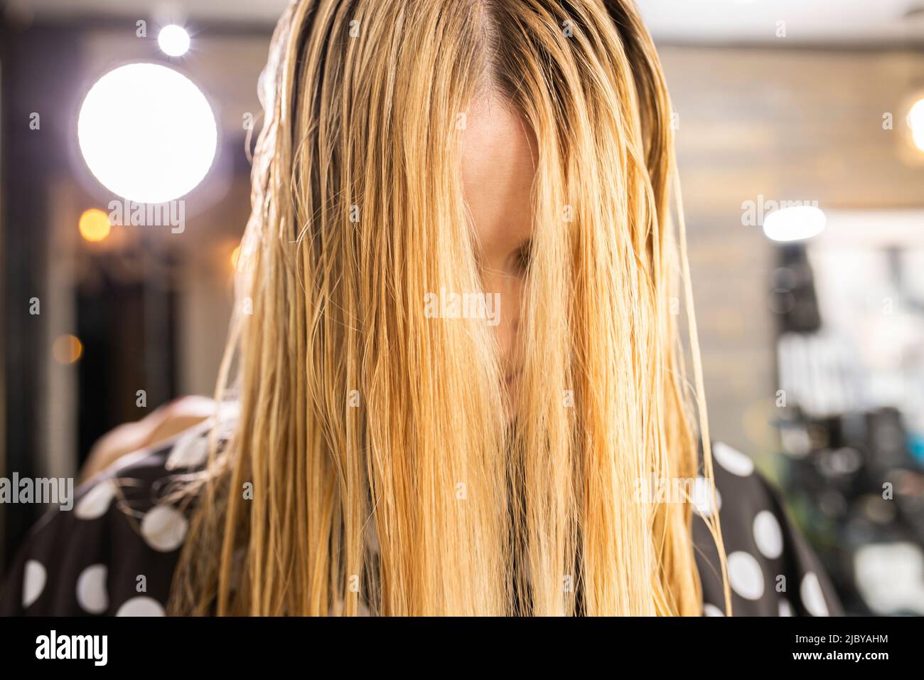 Young woman having haircut at boutique salon Stock Photo - Alamy