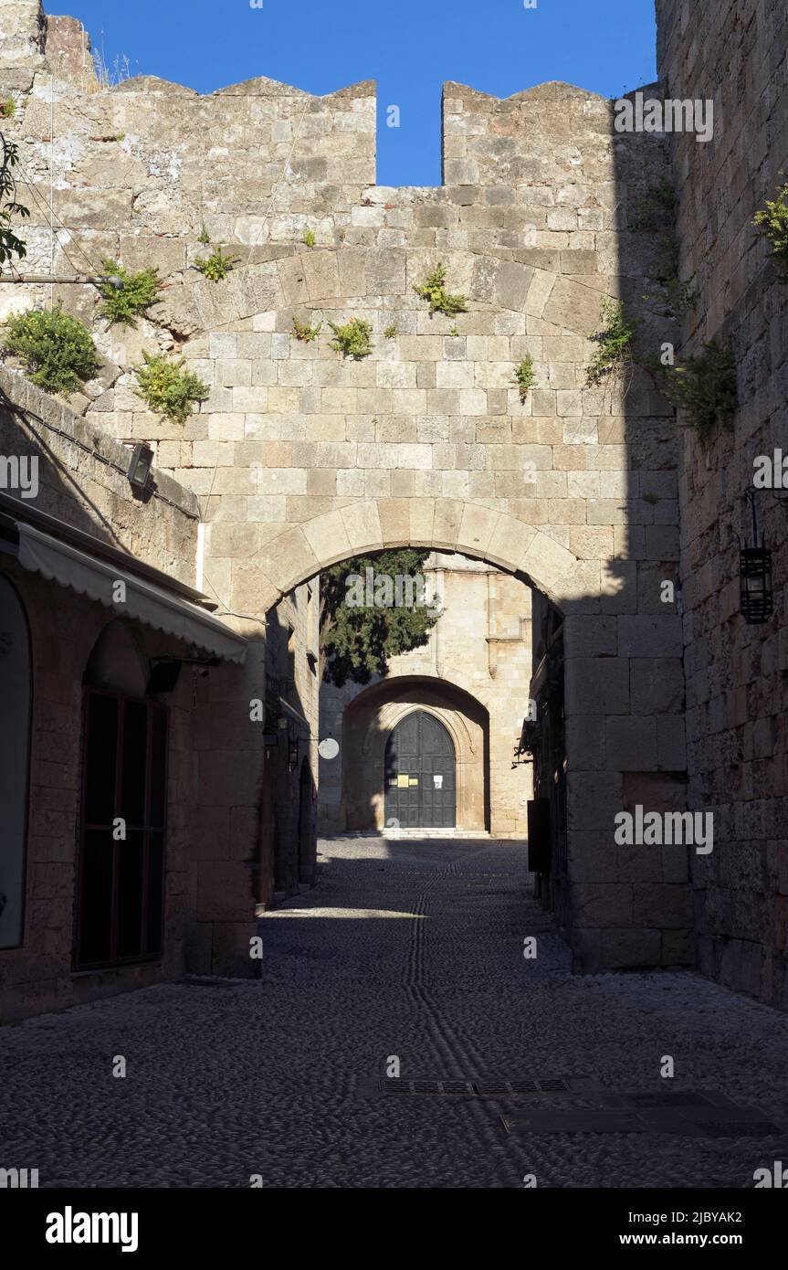 Cobbled alleyway with stone archways, in Rhodes Old Town, Rhodes Island ...