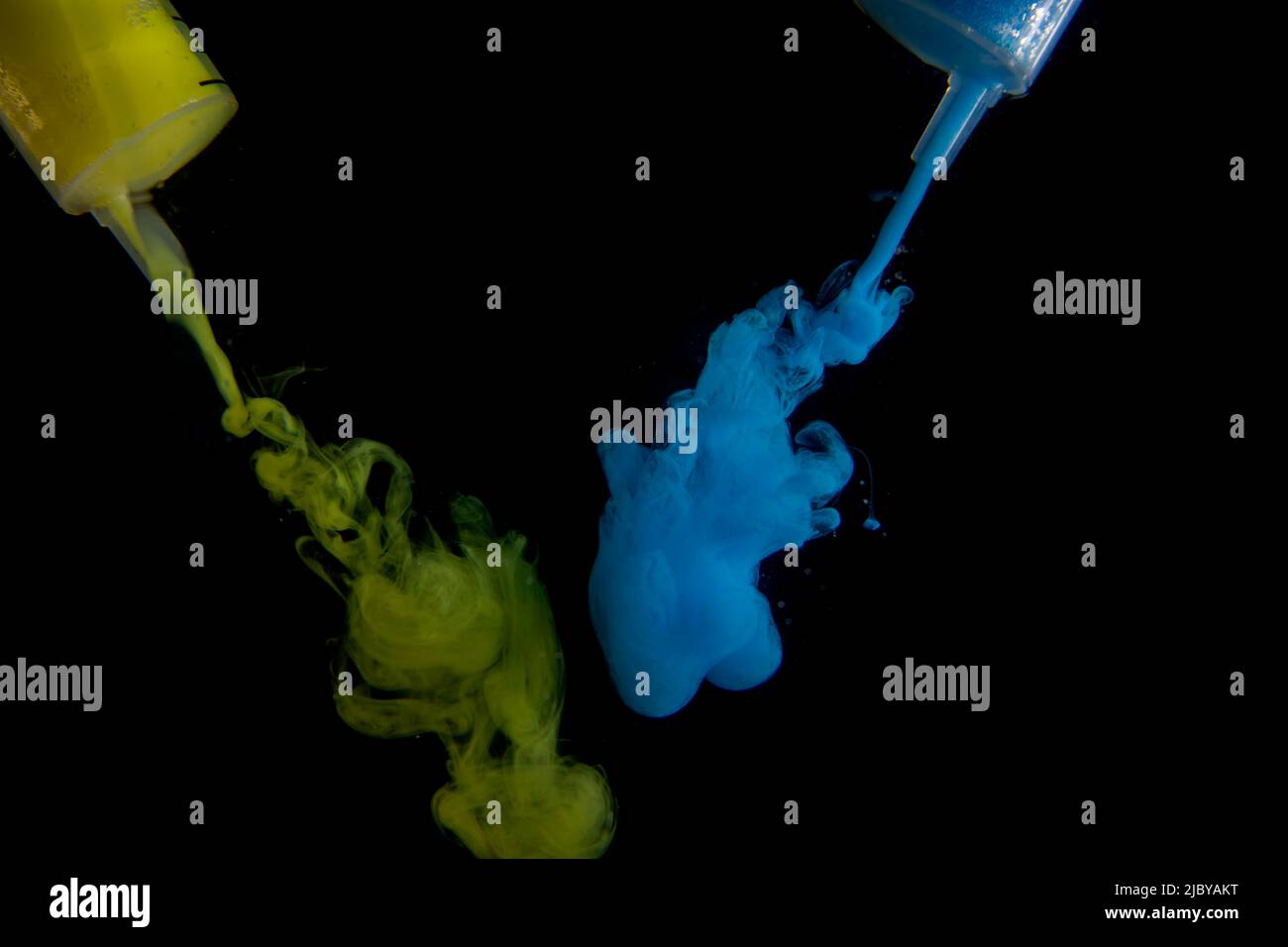 Color drop in water isolated on white background Stock Photo - Alamy