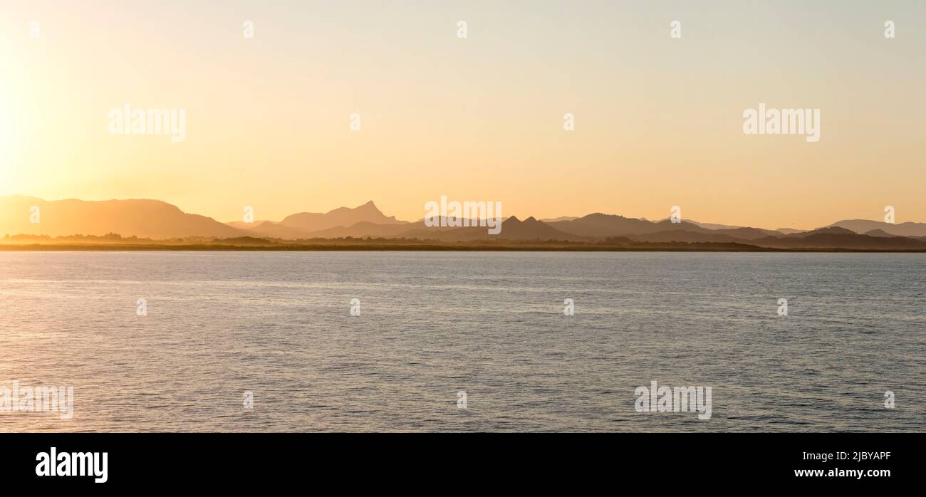 Looking over water towards Mount Warning and hills from Byron Bay at ...