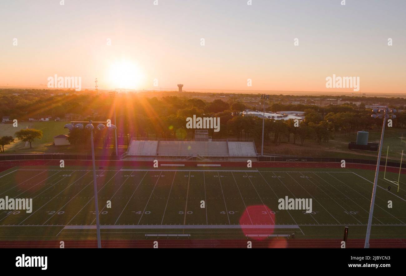 Aerial shot of a high school track and football field in Texas at ...