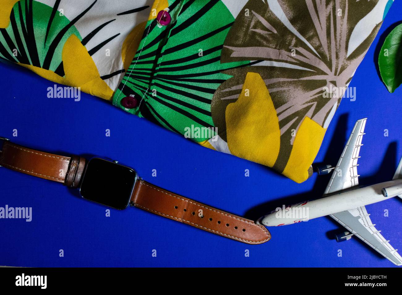 Flat lay travel top view airplane and smart watch Stock Photo - Alamy
