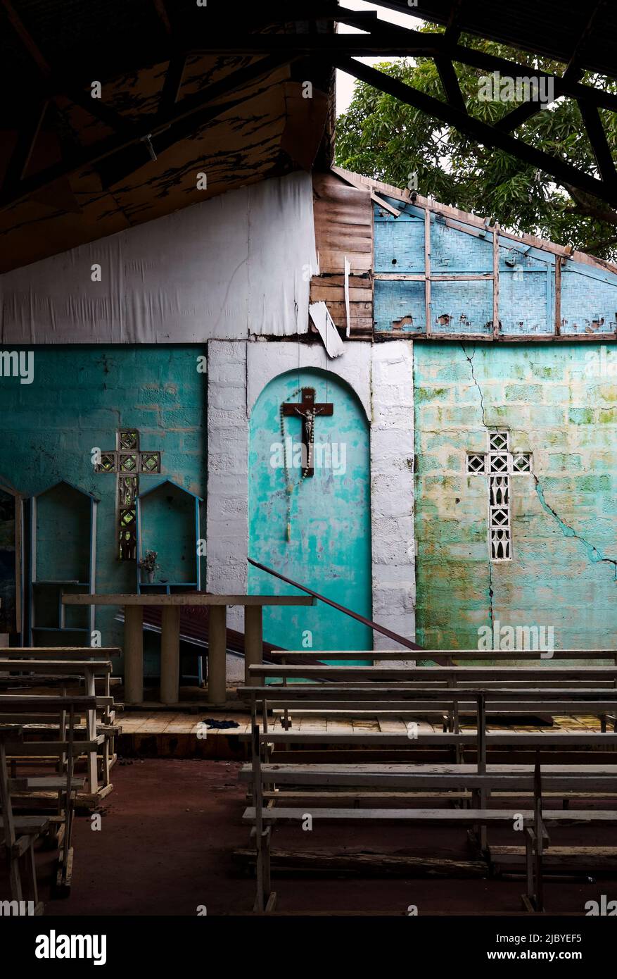 Inside of Catholic Church with half of roof missing on Smokey Mountain ...