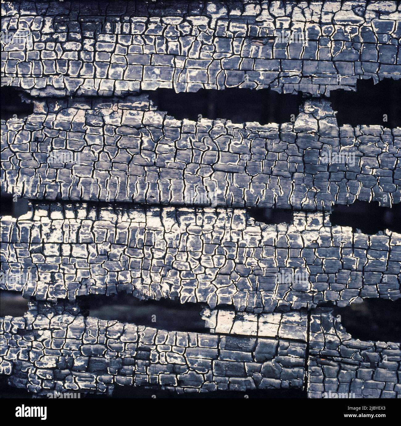 Close up of burnt and charcoaled planks of wood Stock Photo - Alamy