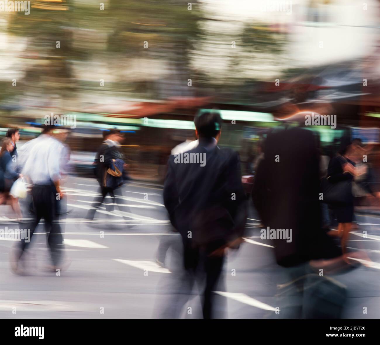 People crossing intersection in city Stock Photo - Alamy