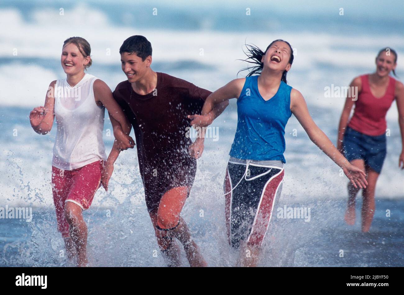 Running in the waves hi-res stock photography and images - Alamy