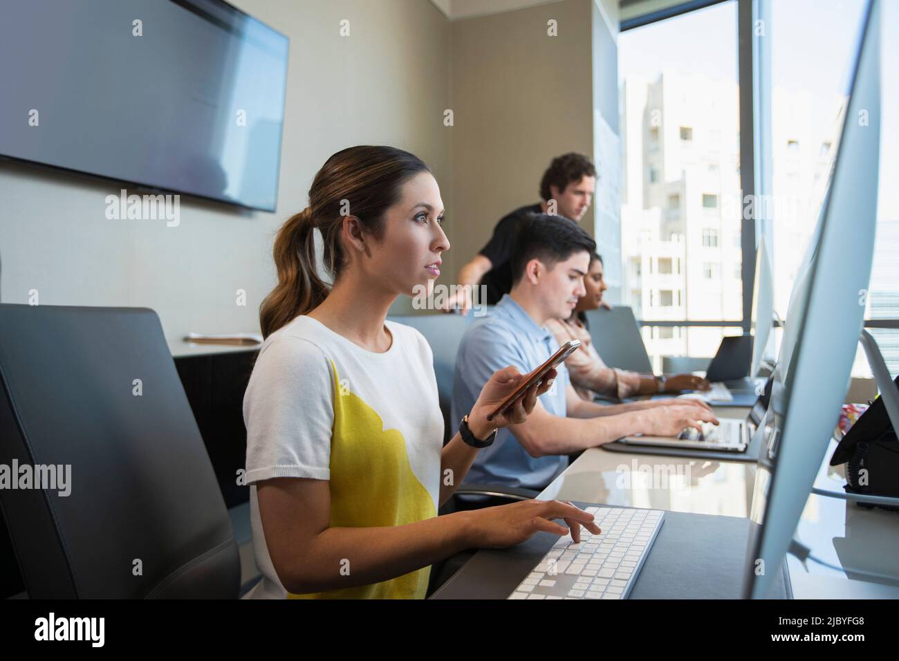 Medium shot computer monitor woman hi-res stock photography and images ...