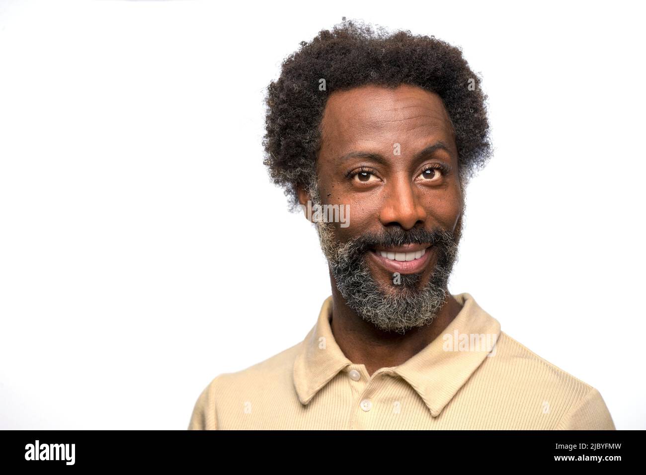 Portrait of middle aged black man with greying beard, looking at camera ... Portrait of middle aged black man with greying beard, looking at camera ...
