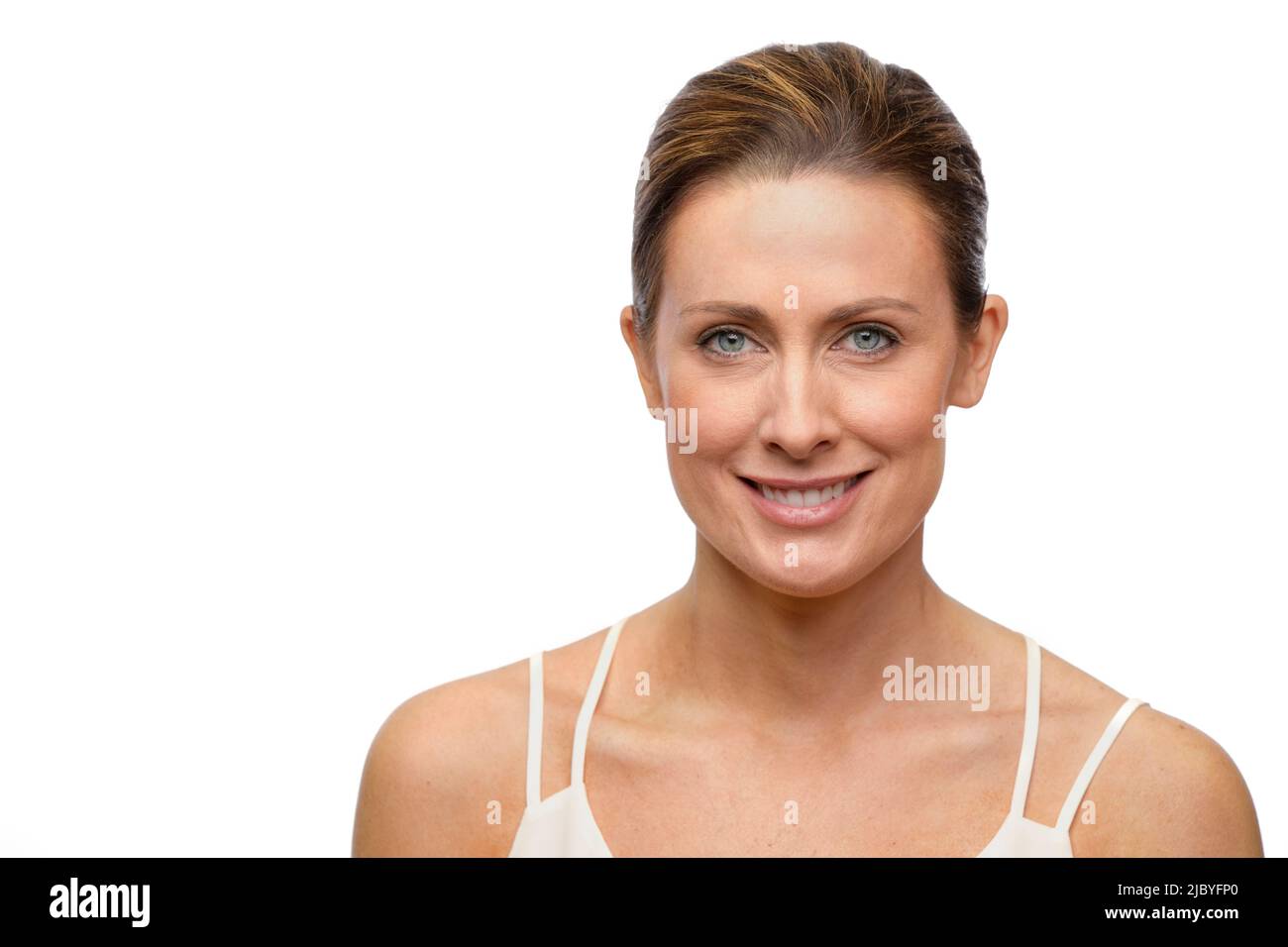 Portrait of middle aged white woman with brown hair pulled back ...