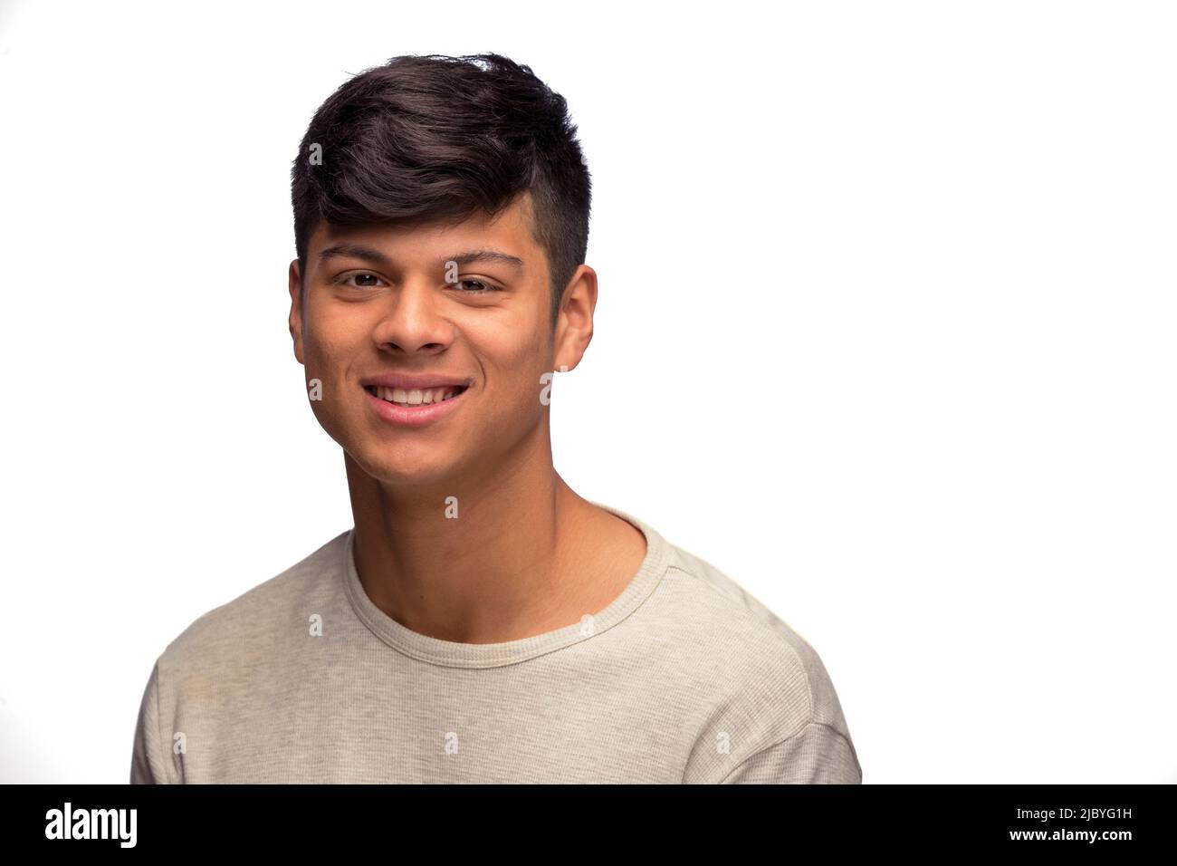 Portrait of young man of Latin decent looking at camera smiling Stock ...