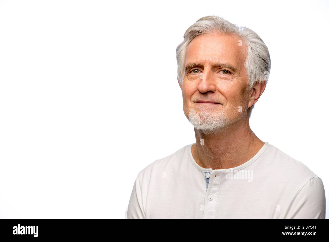Portrait Of Middle Aged White Man With Grey Hair Looking At Camera With Straight Face Stock
