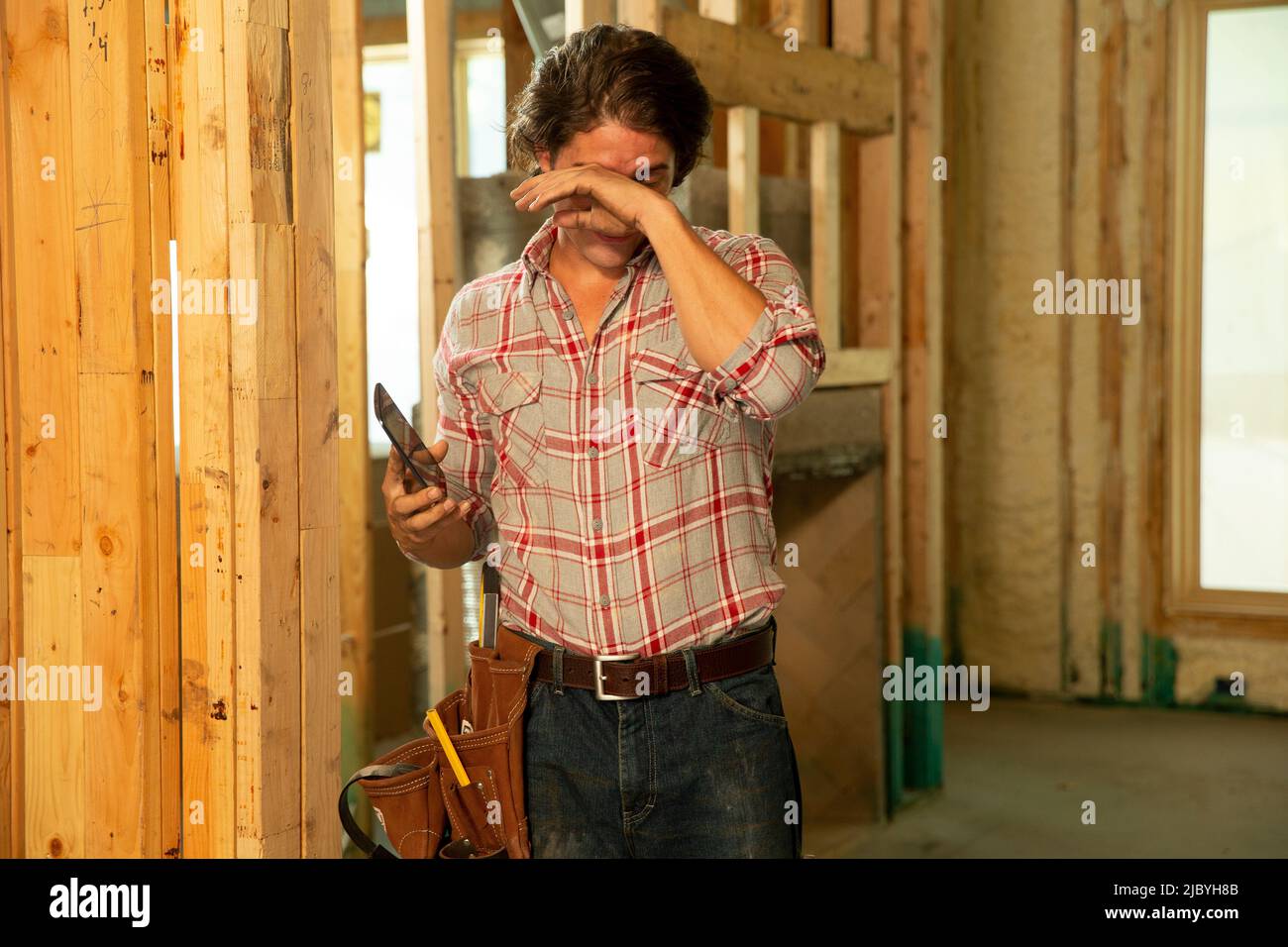 Construction worker on job site feeling ill dealing with headache ...