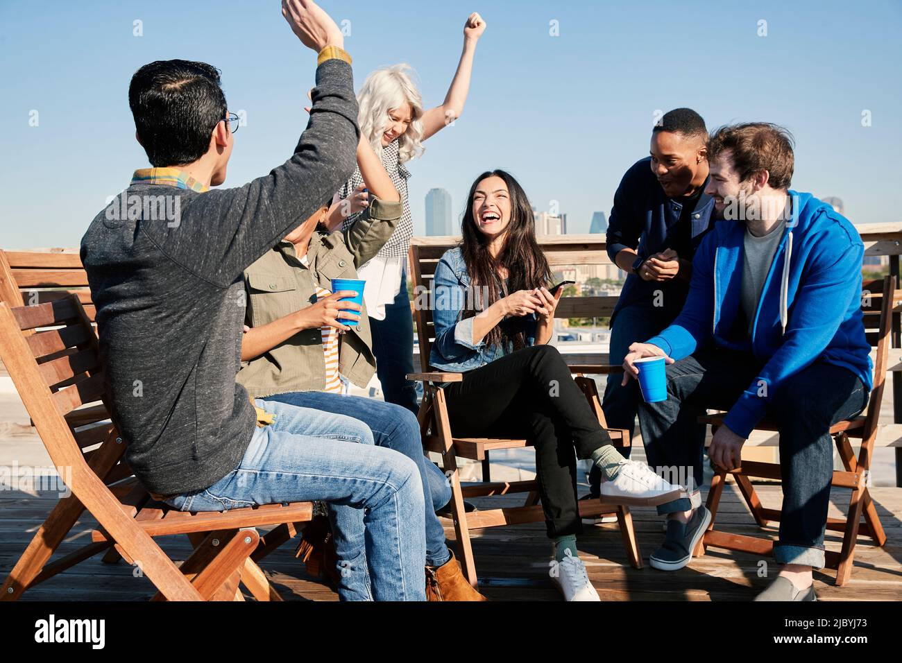 Group young co workers hanging hi-res stock photography and images - Alamy