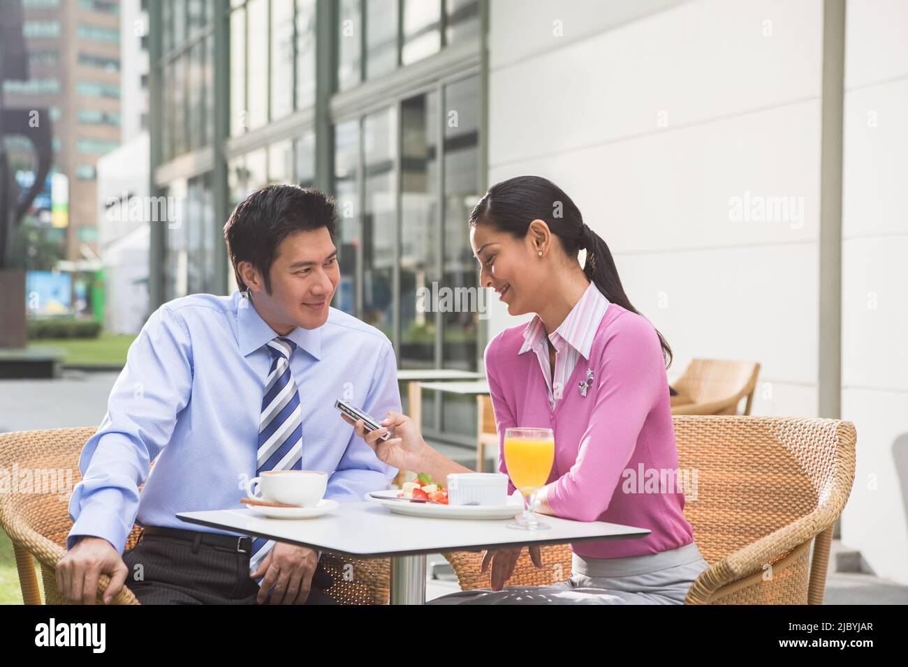 Couple having breakfast together in cafe Stock Photo - Alamy