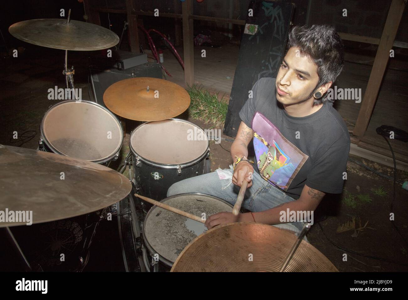 Hispanic man playing the drums Stock Photo - Alamy