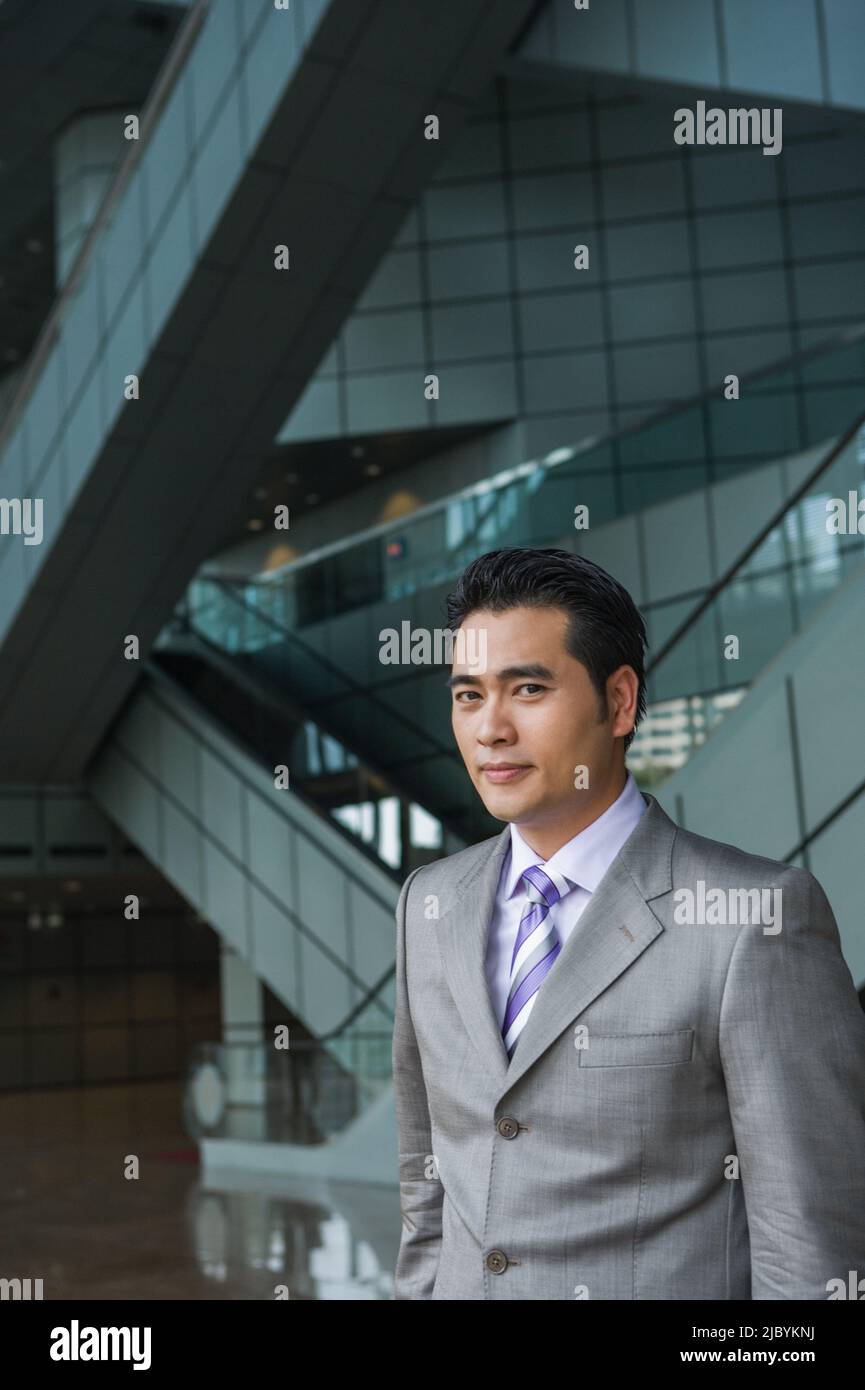 Chinese businessman smiling Stock Photo - Alamy