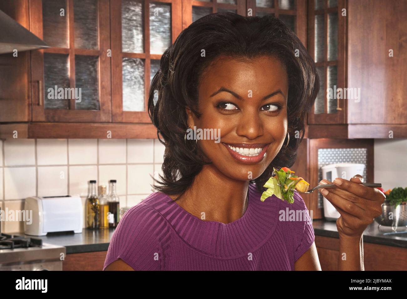 African lady eating salad hi-res stock photography and images - Alamy