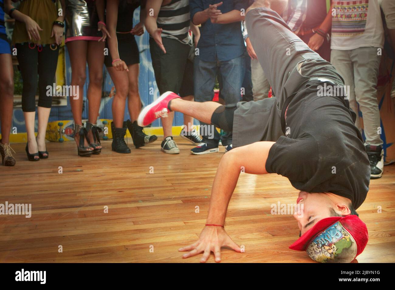 Friends watching man dancing at party Stock Photo - Alamy
