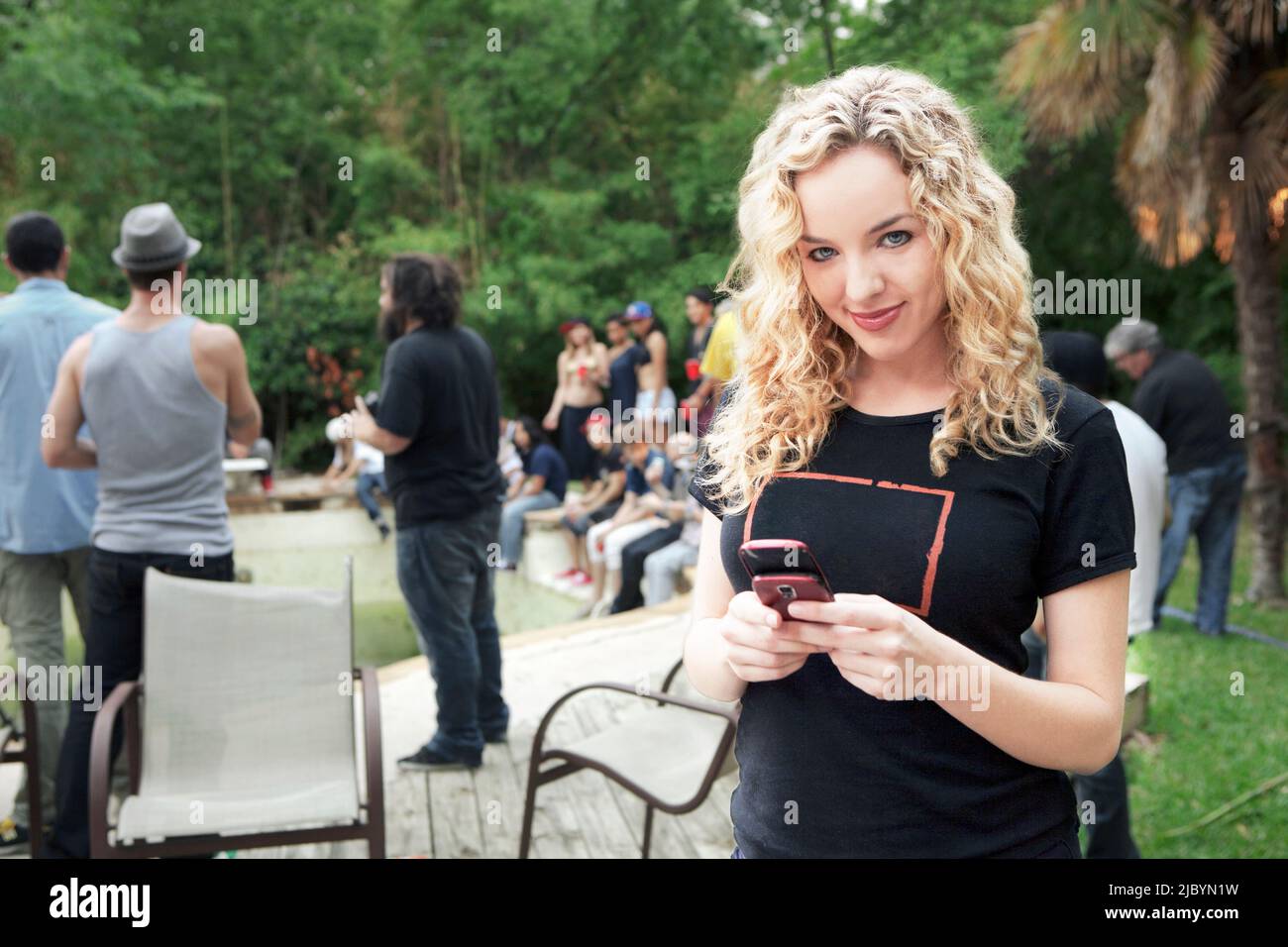 Friends hanging out poolside hi-res stock photography and images - Alamy