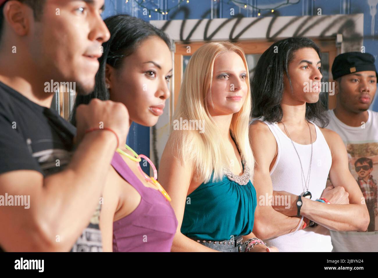 Friends hanging out at party together Stock Photo - Alamy