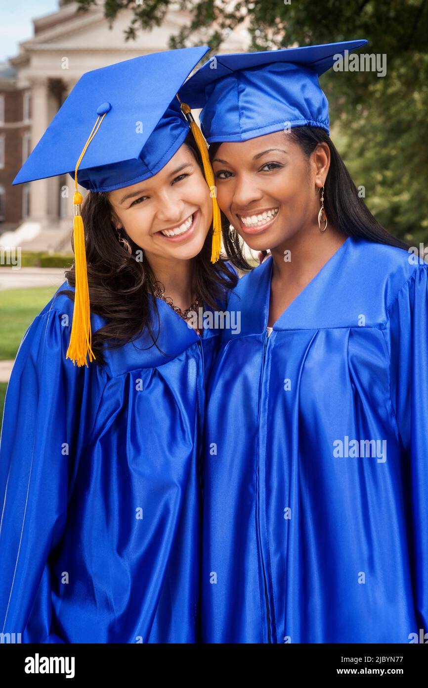 Portrait two female graduates hugging hi-res stock photography and ...