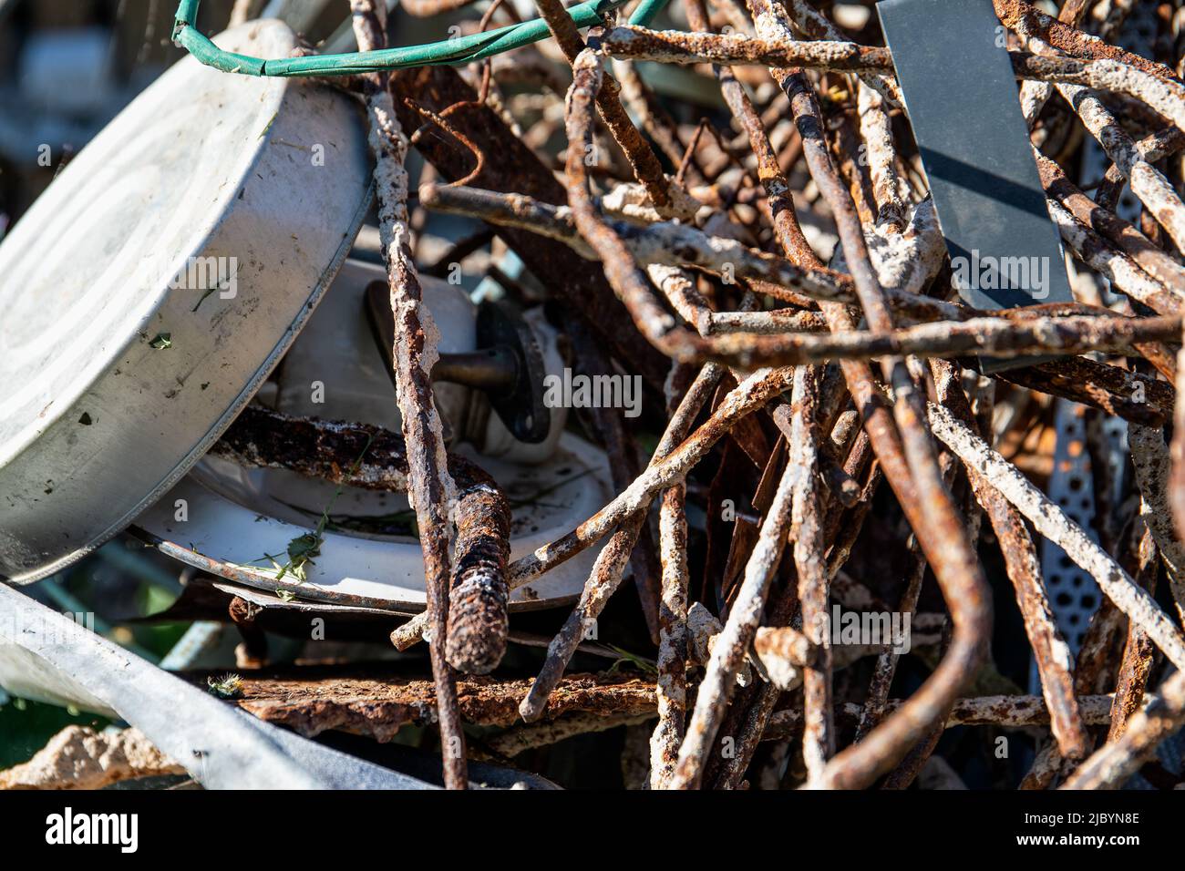 Scrap metal and recycling. Backyard and cleaning concept Stock Photo ...