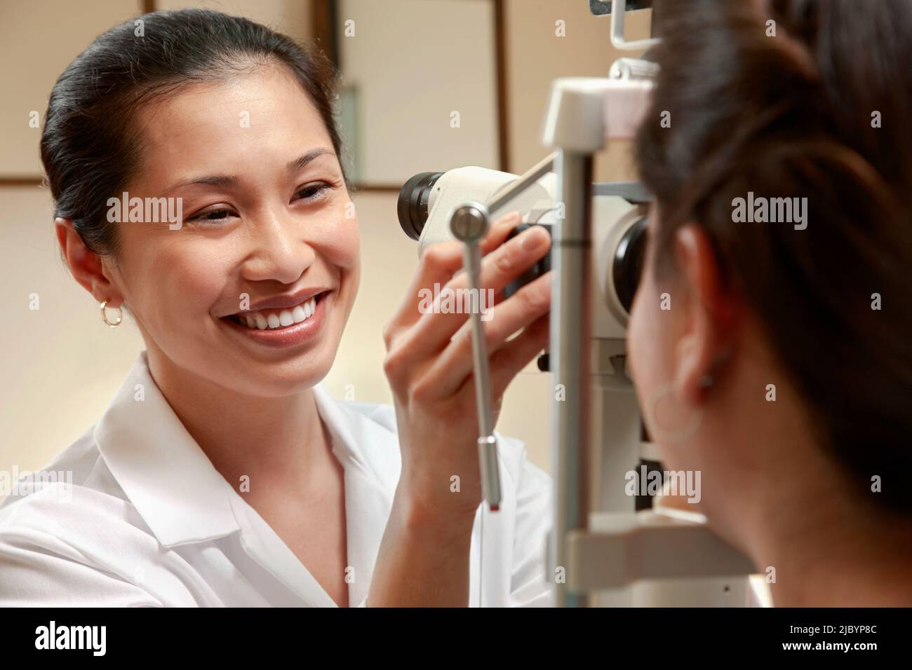 Optician examining patient's vision Stock Photo - Alamy