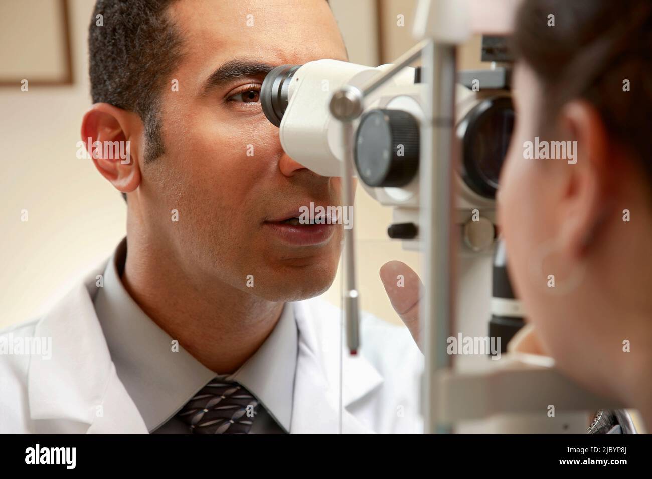 Optician examining patient's vision Stock Photo - Alamy