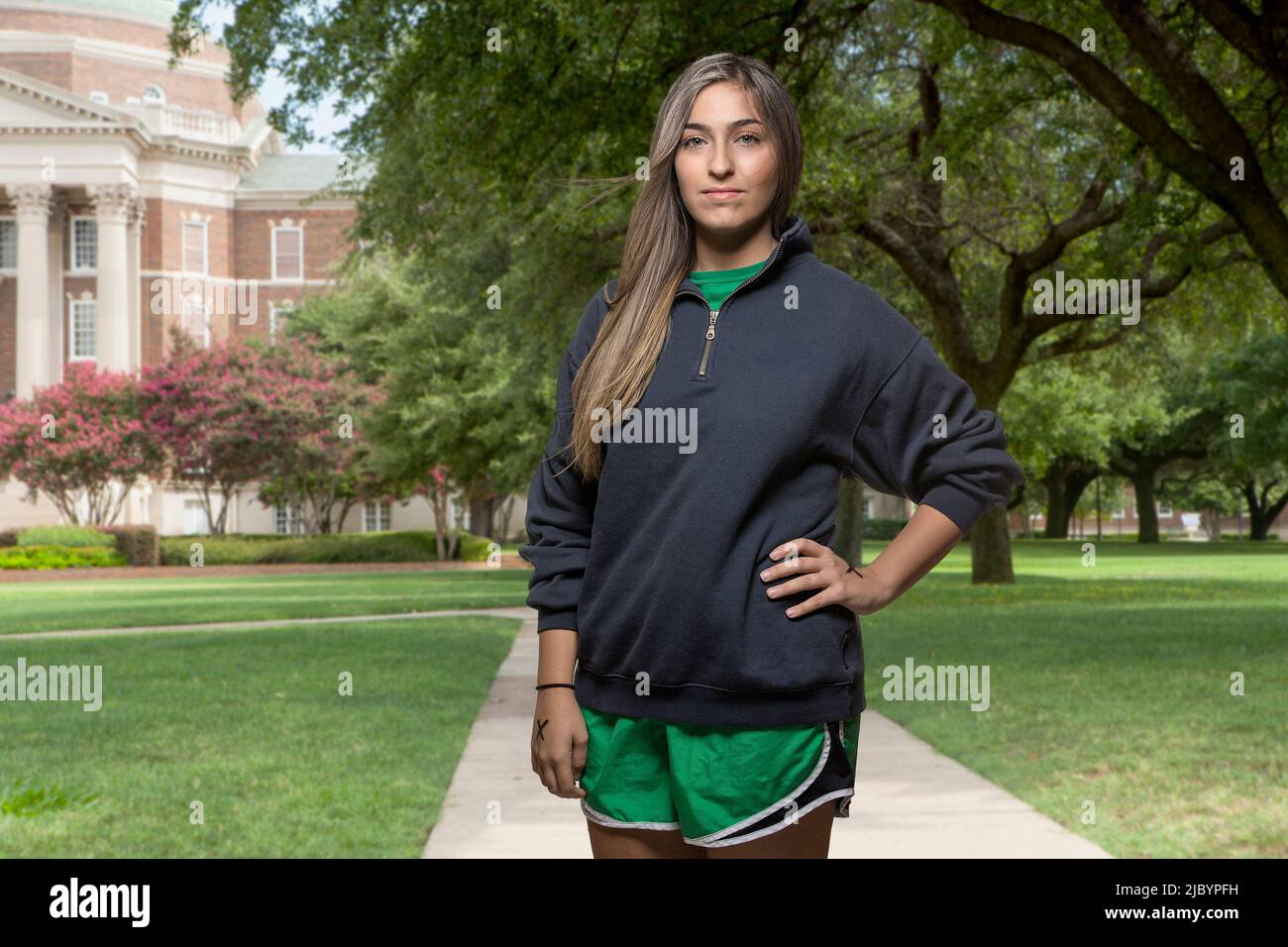 Middle Eastern student standing on college campus Stock Photo - Alamy
