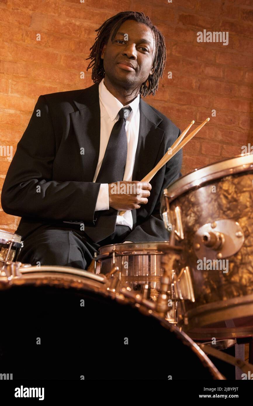 African man playing drums Stock Photo - Alamy
