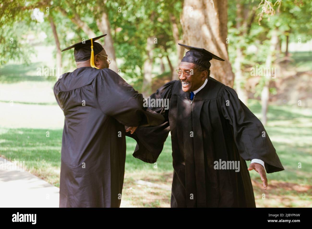 Senior African men in graduation caps and robes Stock Photo - Alamy