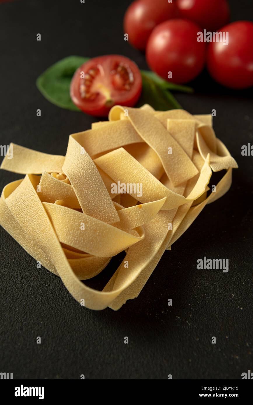 raw paste Pappardelle close-up vertical shot. Flat lay Stock Photo - Alamy