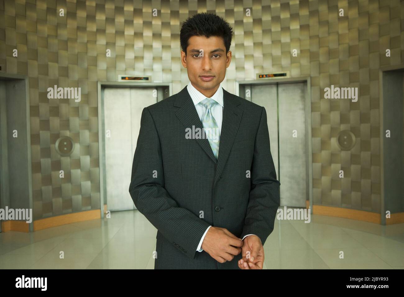 Indian businessman in office lobby Stock Photo - Alamy