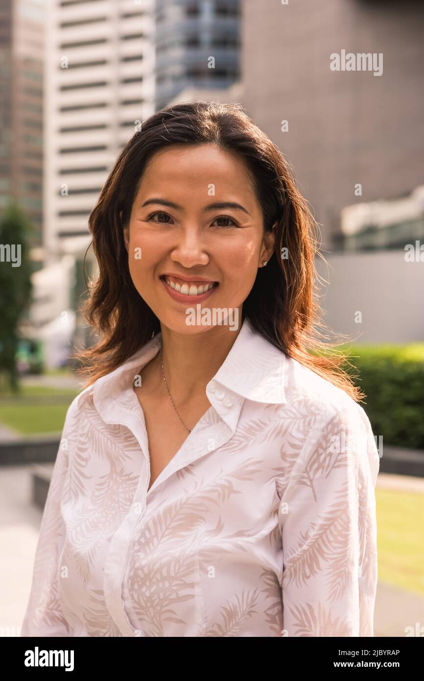 Smiling Asian woman Stock Photo - Alamy